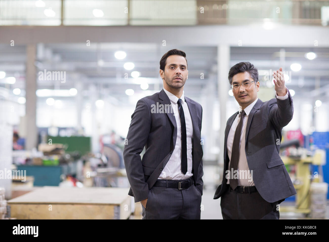 Business people talking in the factory Stock Photo - Alamy