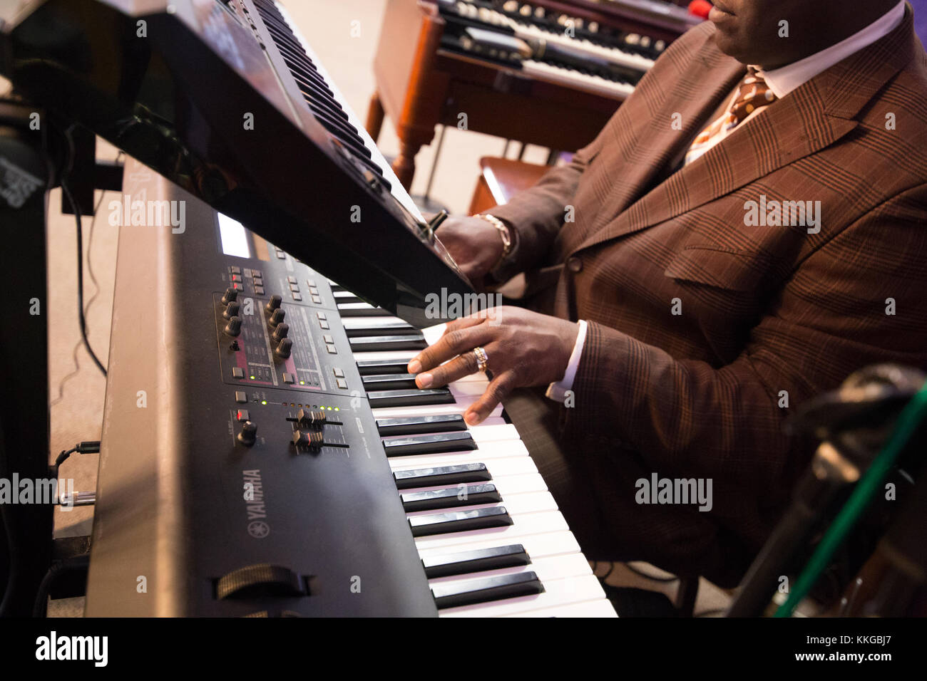 Man wearing brown suit playing keyboard hi-res stock photography and ...