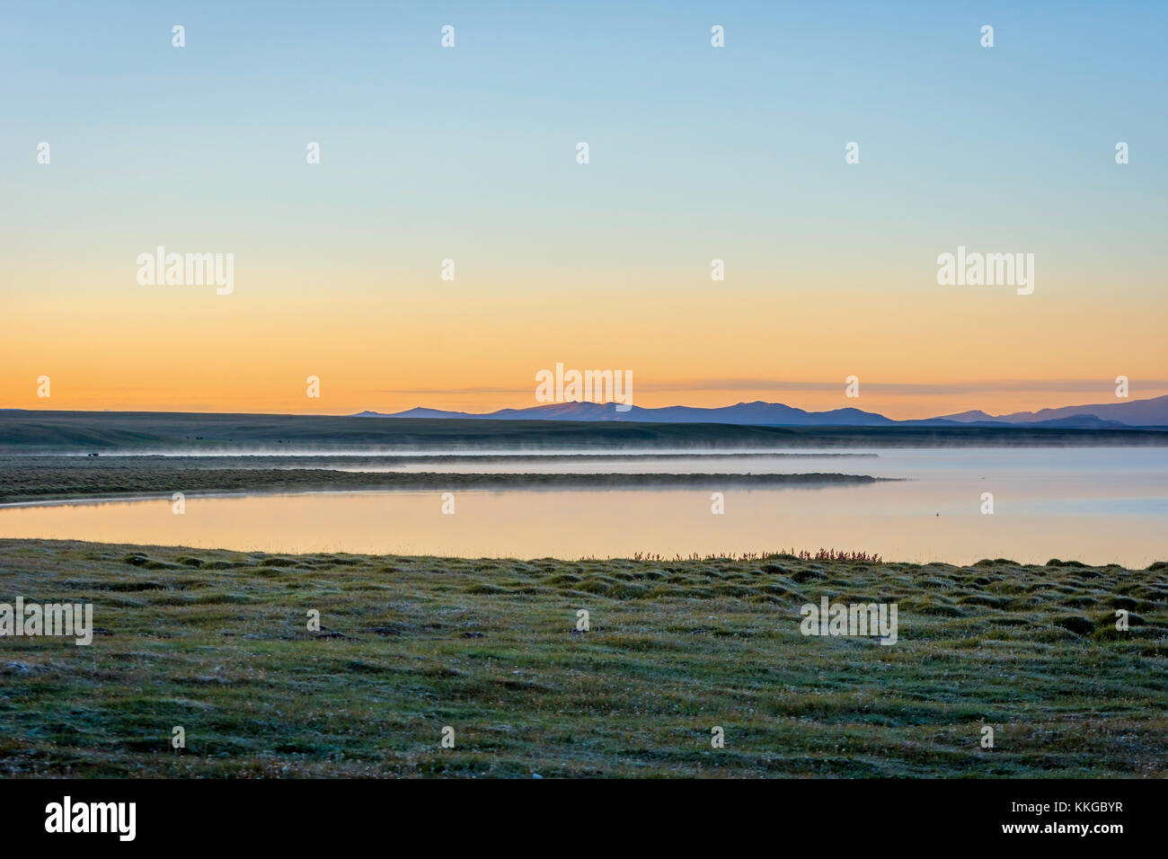 Song Kul lake in mist in early morning light, Kyrgyzstan Stock Photo ...