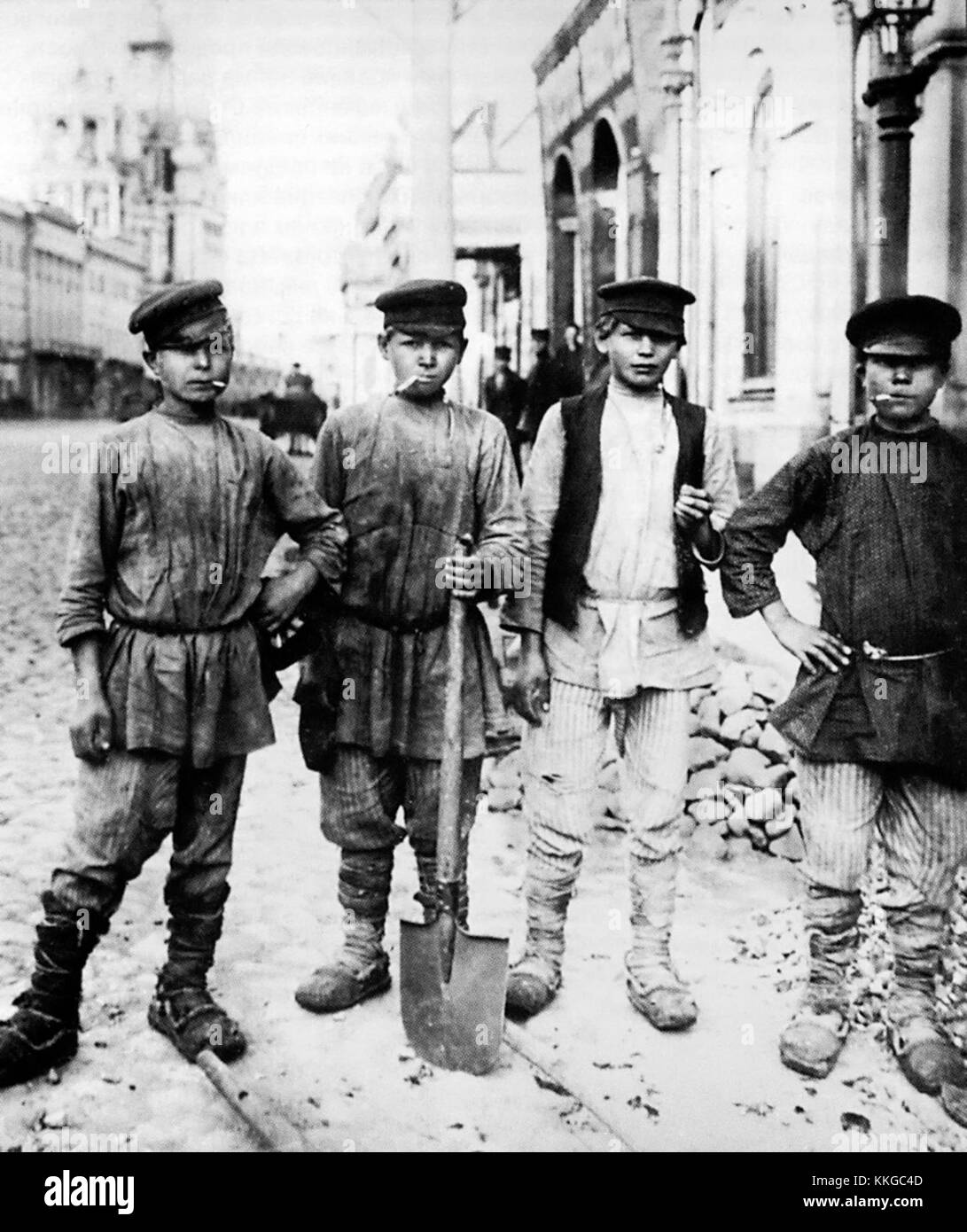 A historic photograph from the 1900s depicting children at work on ...