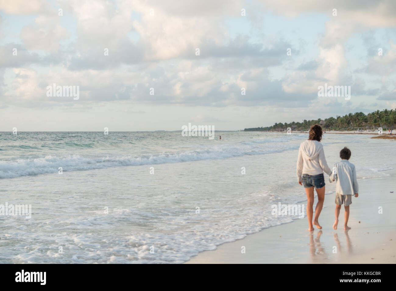 TULUM, MEXICO - JANUARY 29, 2015: MOTHER AND SON WALK ON BEACH Stock ...