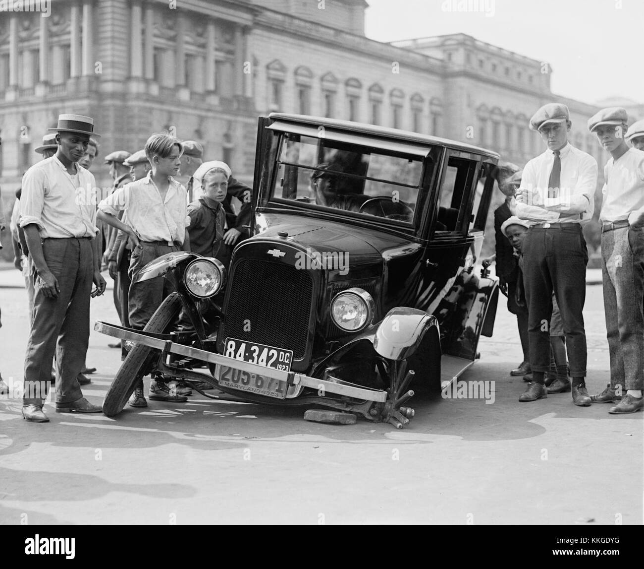 This image depicts a car wreck in the USA from 1923, showcasing early ...