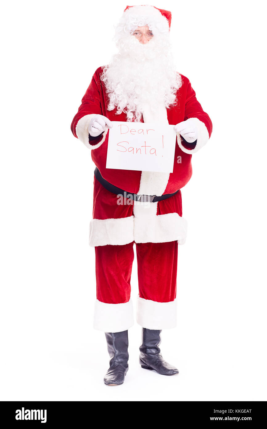 Santa holding wish letter Stock Photo - Alamy
