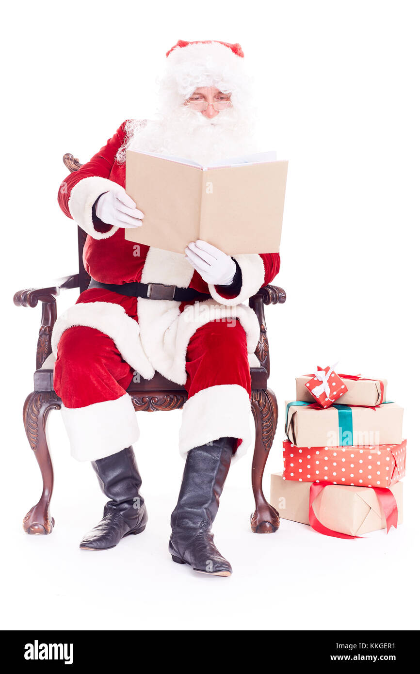 Santa reading tale Stock Photo - Alamy
