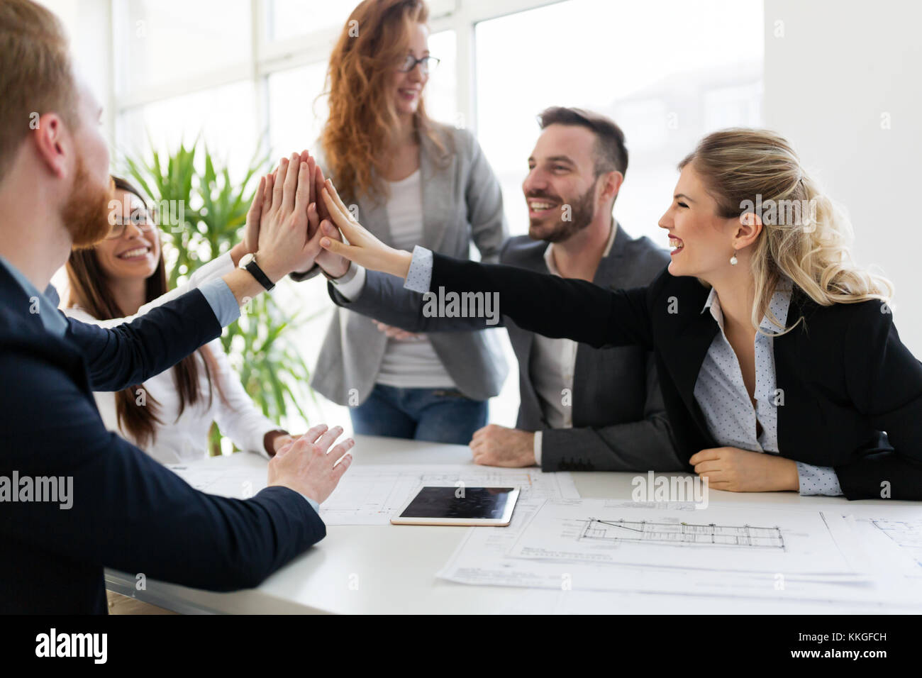 Team of architects working together on project Stock Photo - Alamy
