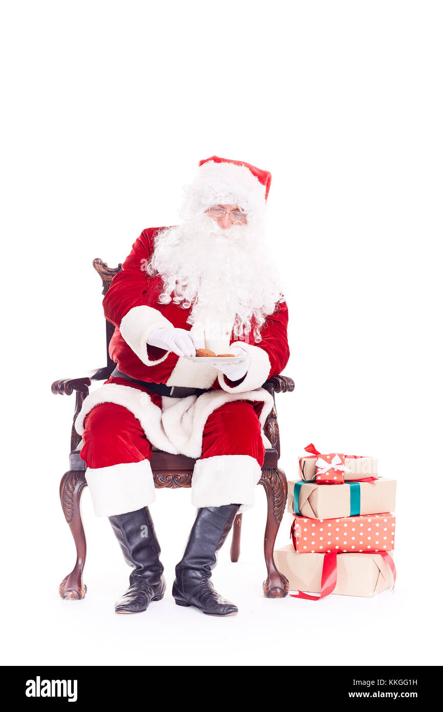 Santa eating cookies Stock Photo - Alamy