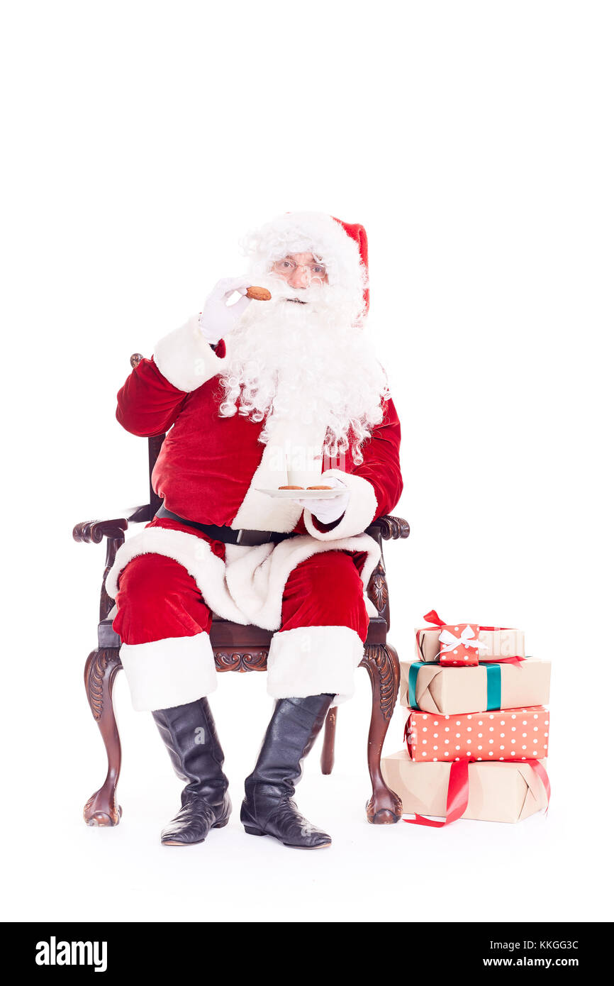 Santa eating cookies Stock Photo - Alamy