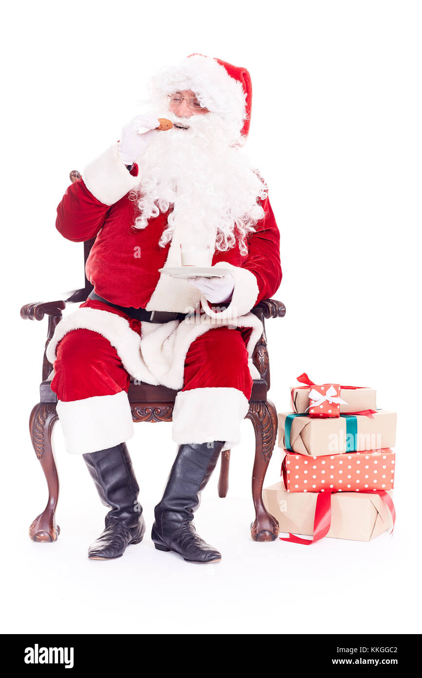 Santa eating cookies Stock Photo - Alamy