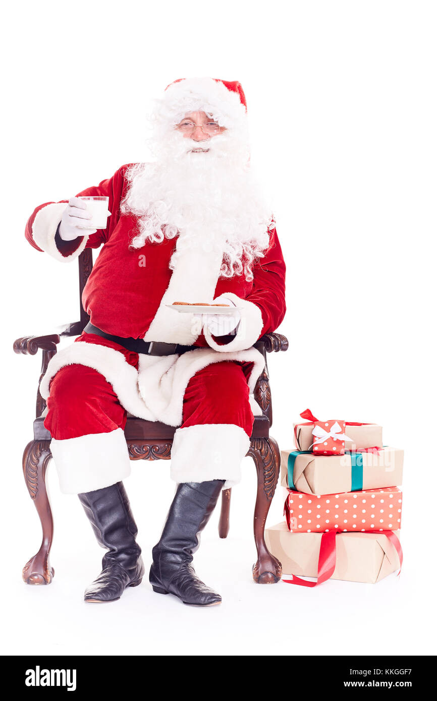 Santa eating cookies Stock Photo - Alamy