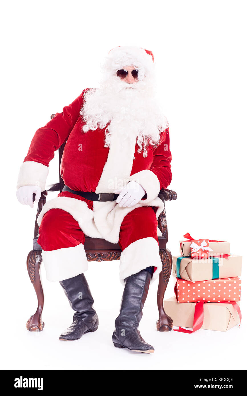 Swaggy Santa relaxing in chair Stock Photo - Alamy
