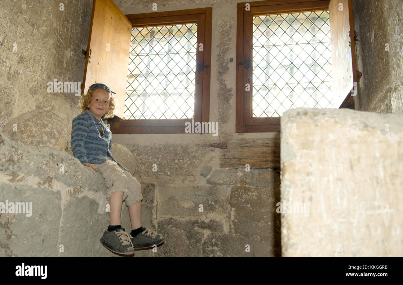 a little blond boy sitting near a window Stock Photo - Alamy a little blond boy sitting near a window Stock Photo - Alamy