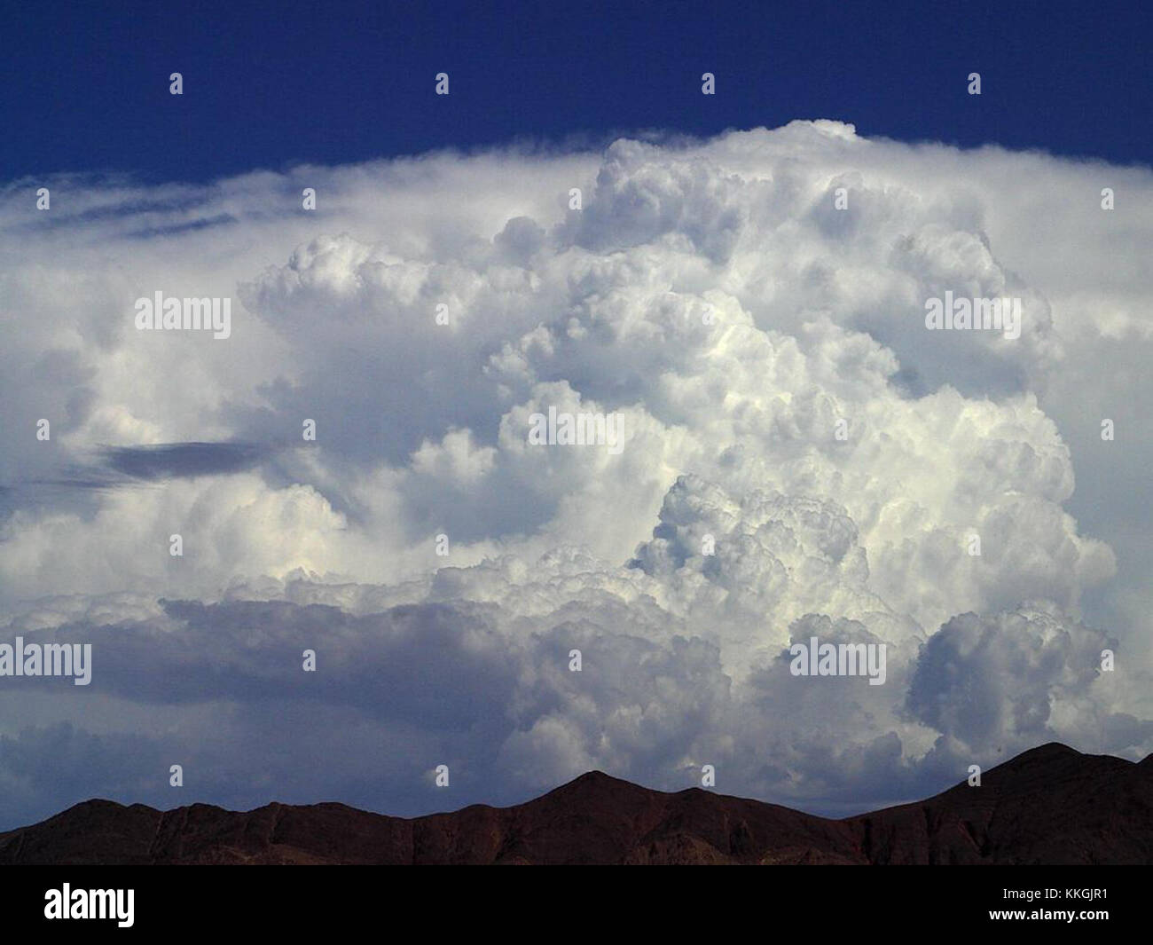 A dramatic photograph of clouds captured against a striking background ...