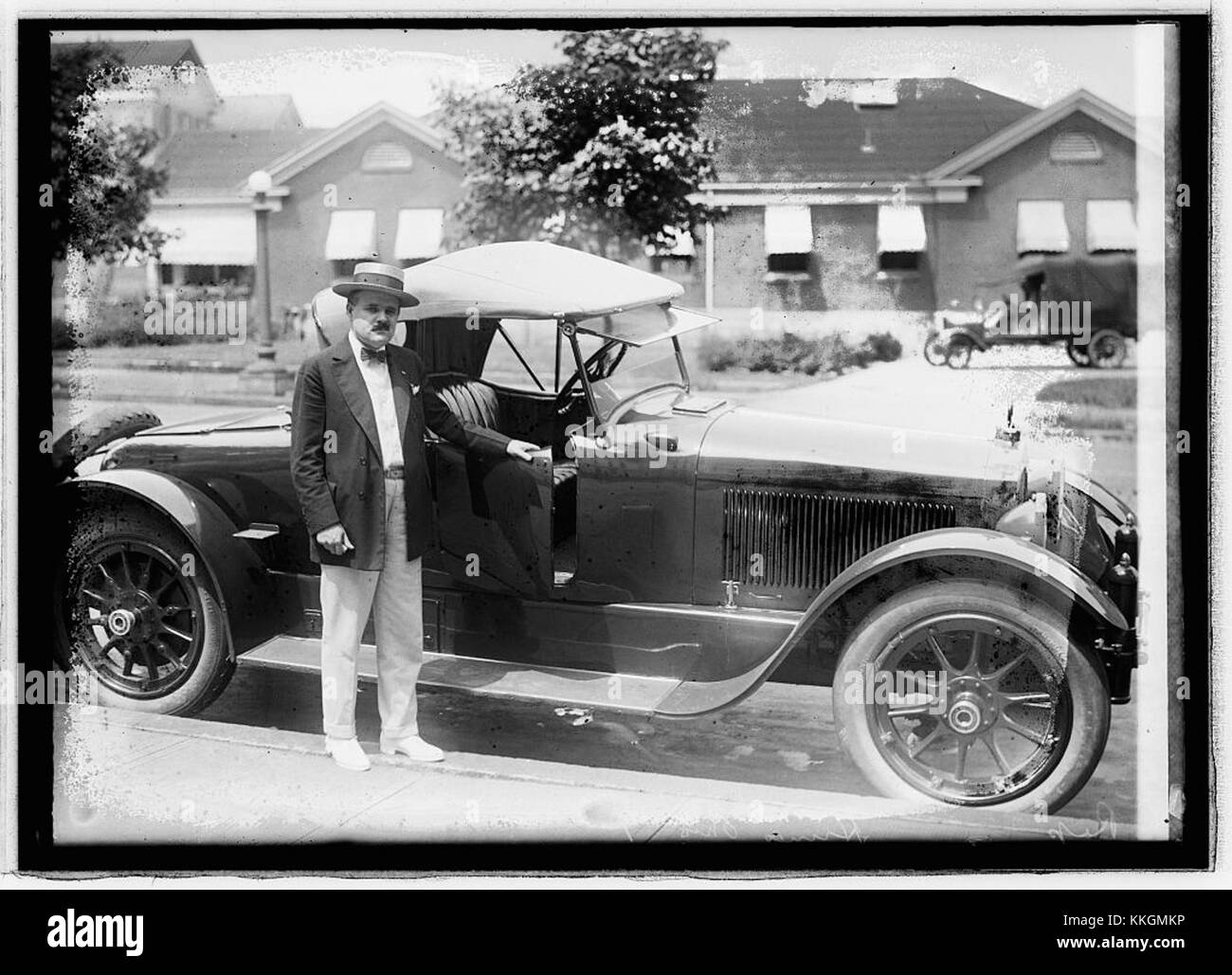 Joseph H. Himes, a notable figure, is seen with a Packard car ...
