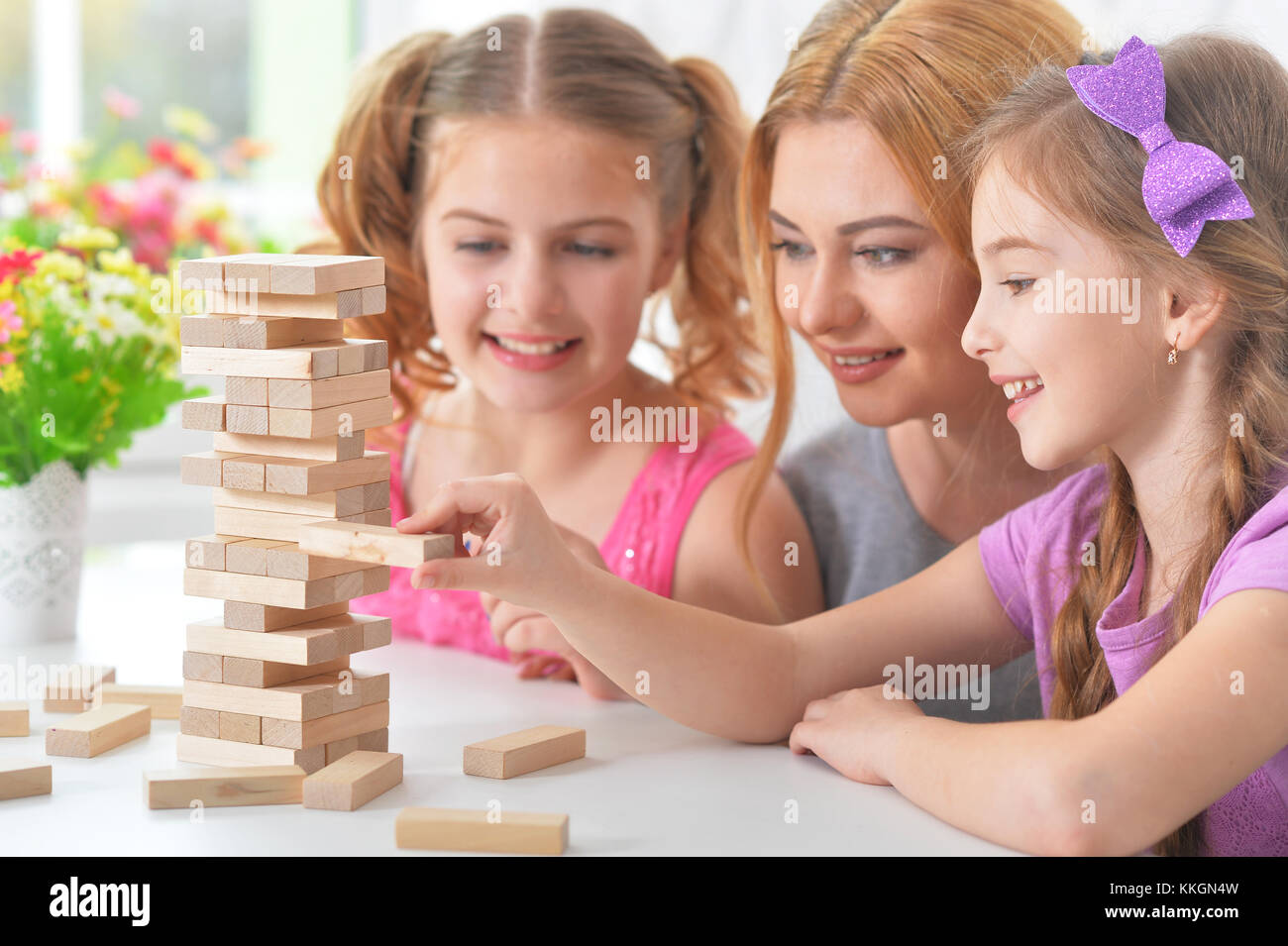 Family playing with blocks together Stock Photo - Alamy