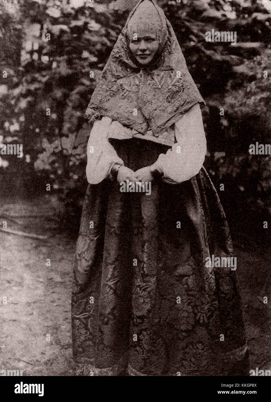 This artifact showcases a traditional Russian costume, reflecting the ...