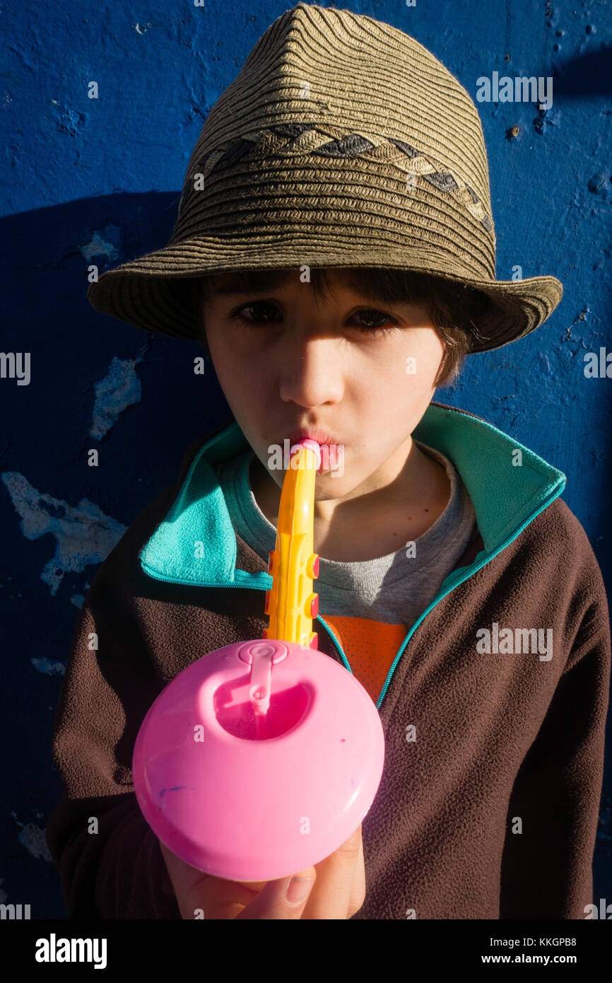 OAXACA, MEXICO - JANUARY 10, 2015: YOUNG BOY SMOKES BUBBLE PIPE Stock ...