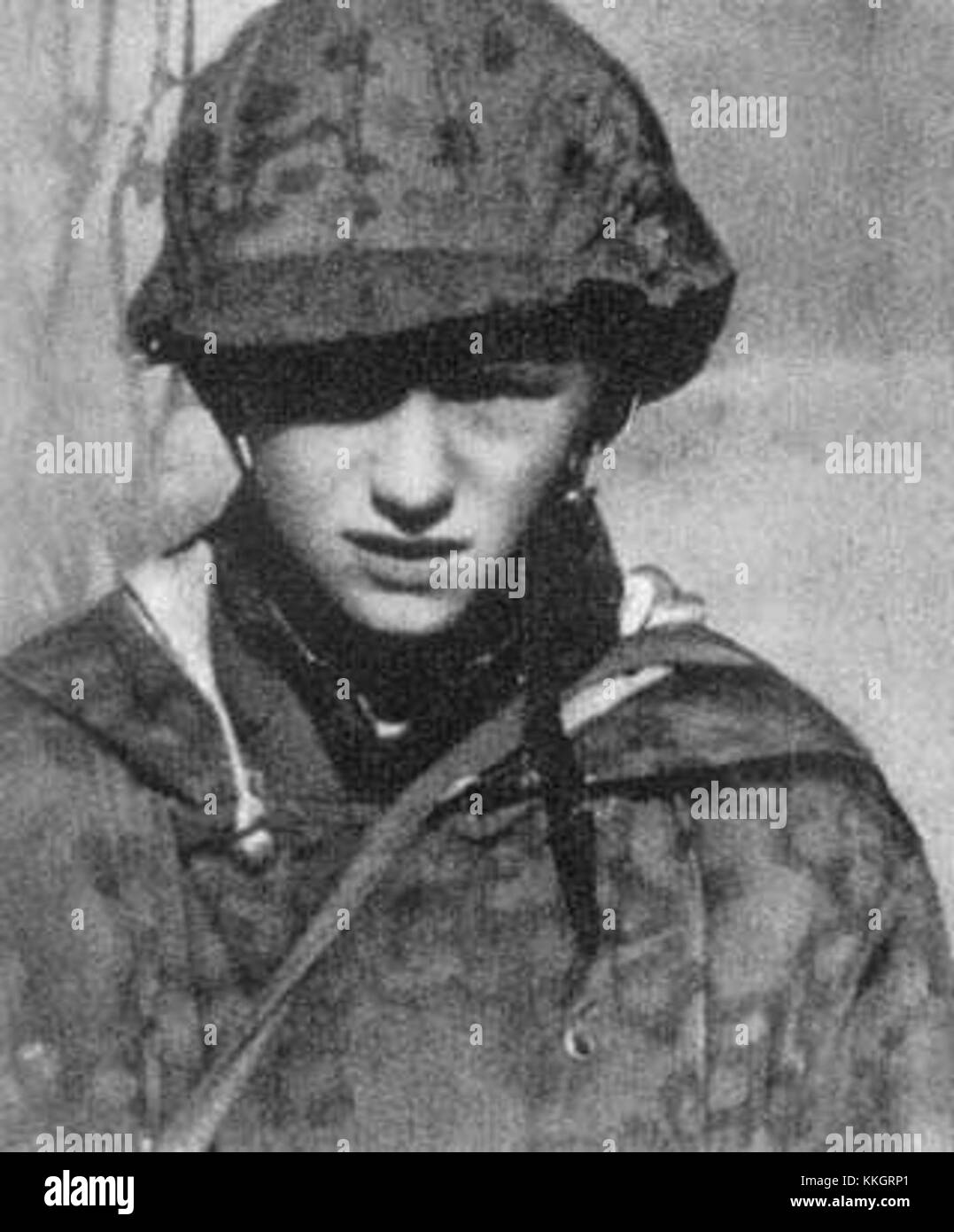 A historical photograph of a young soldier during the Warsaw Uprising ...