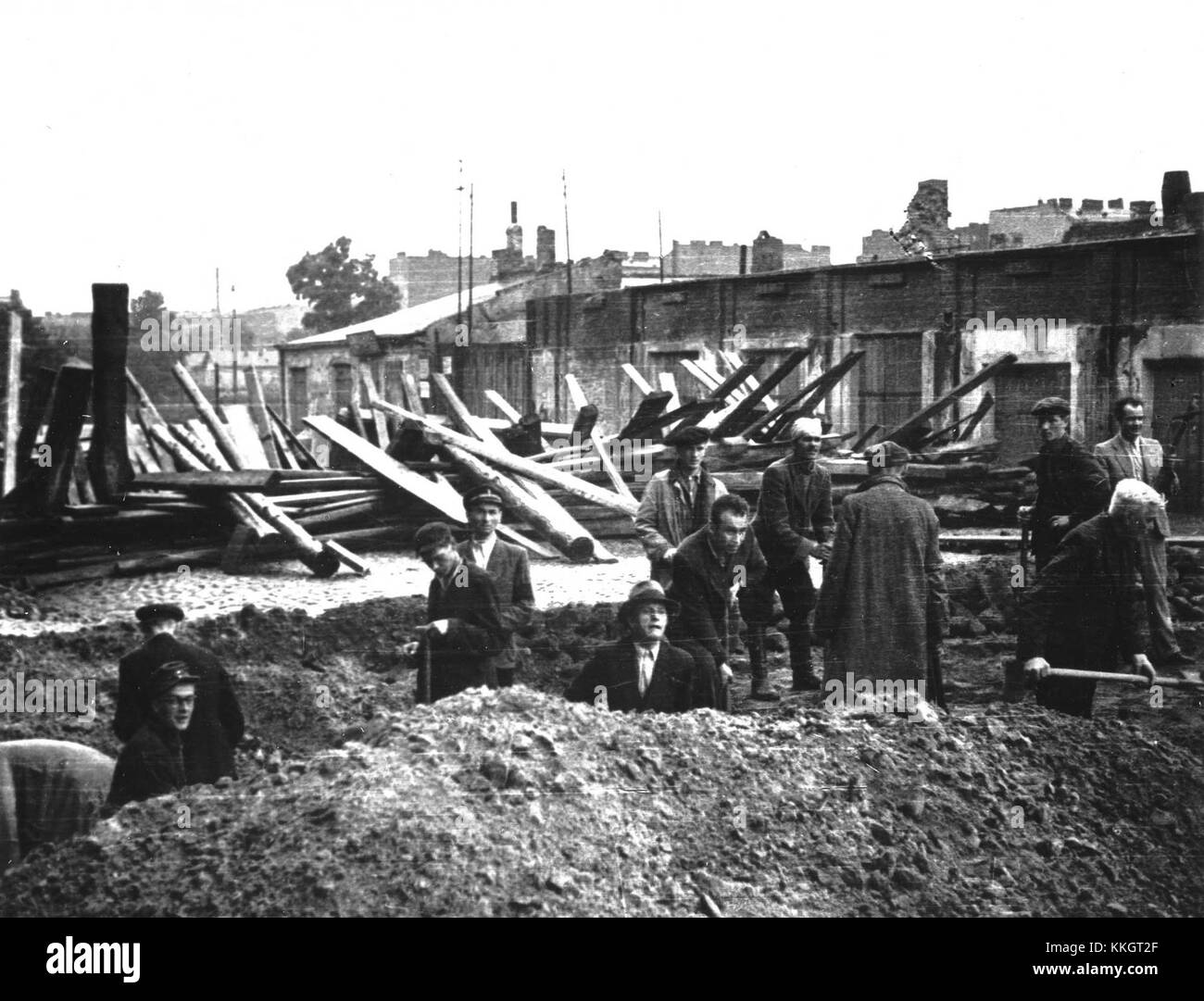 A historical photograph of a trench and barricade in Wola, Warsaw ...