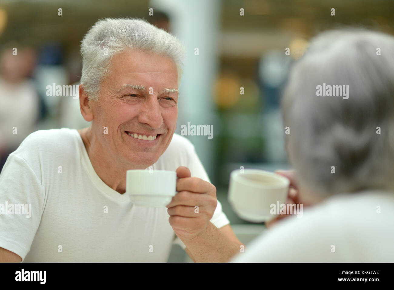 Elderly couple in cafe Stock Photo - Alamy