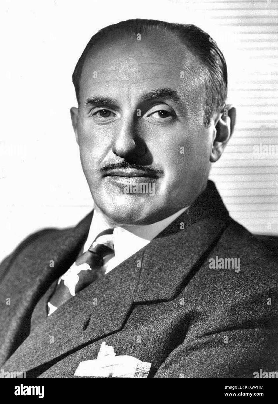 The image is a portrait of Jack Warner, a notable figure, possibly in ...