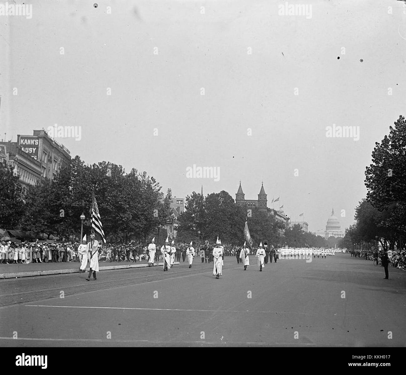 A photograph from 1925 depicting a Ku Klux Klan parade. The image shows ...