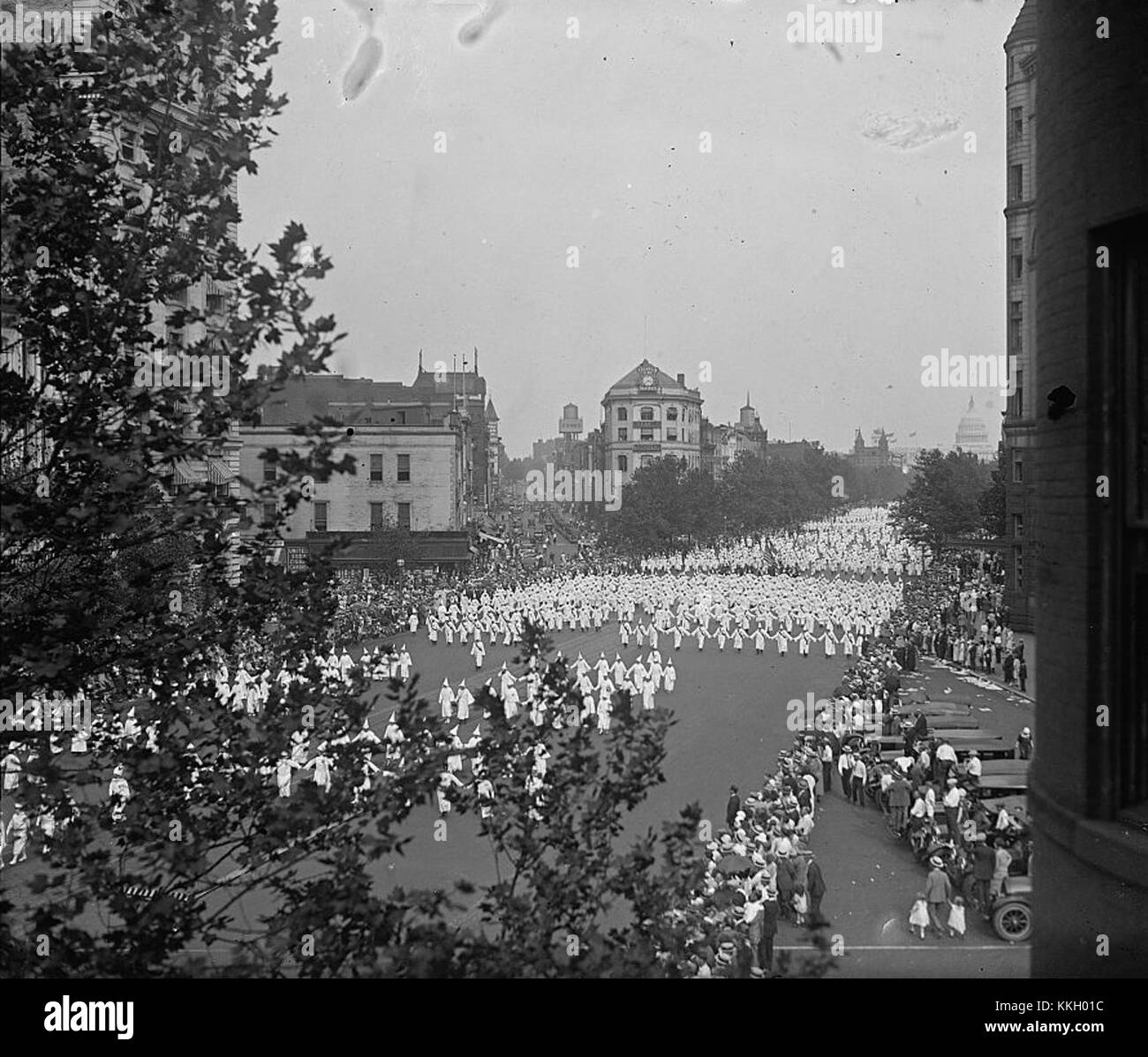 This 1925 photograph captures a Ku Klux Klan parade, reflecting the ...