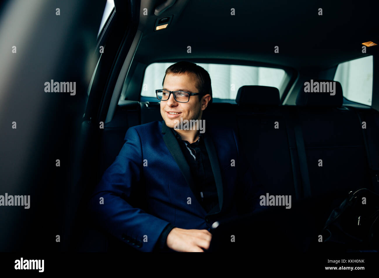 transport, business trip, safety concept - businessman driving on car ...