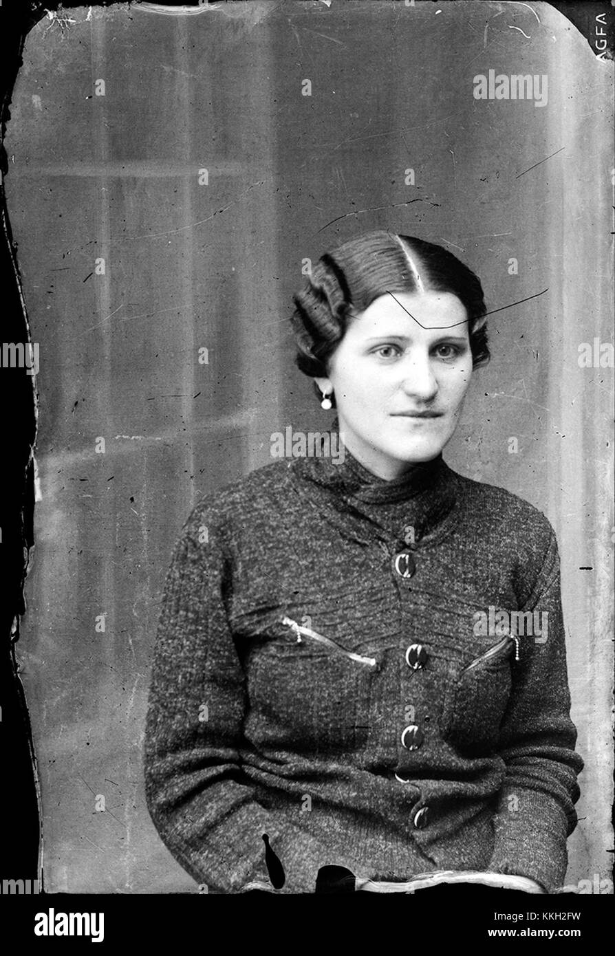 This photograph captures a woman, labeled 'Femeie Ca,' taken in early ...