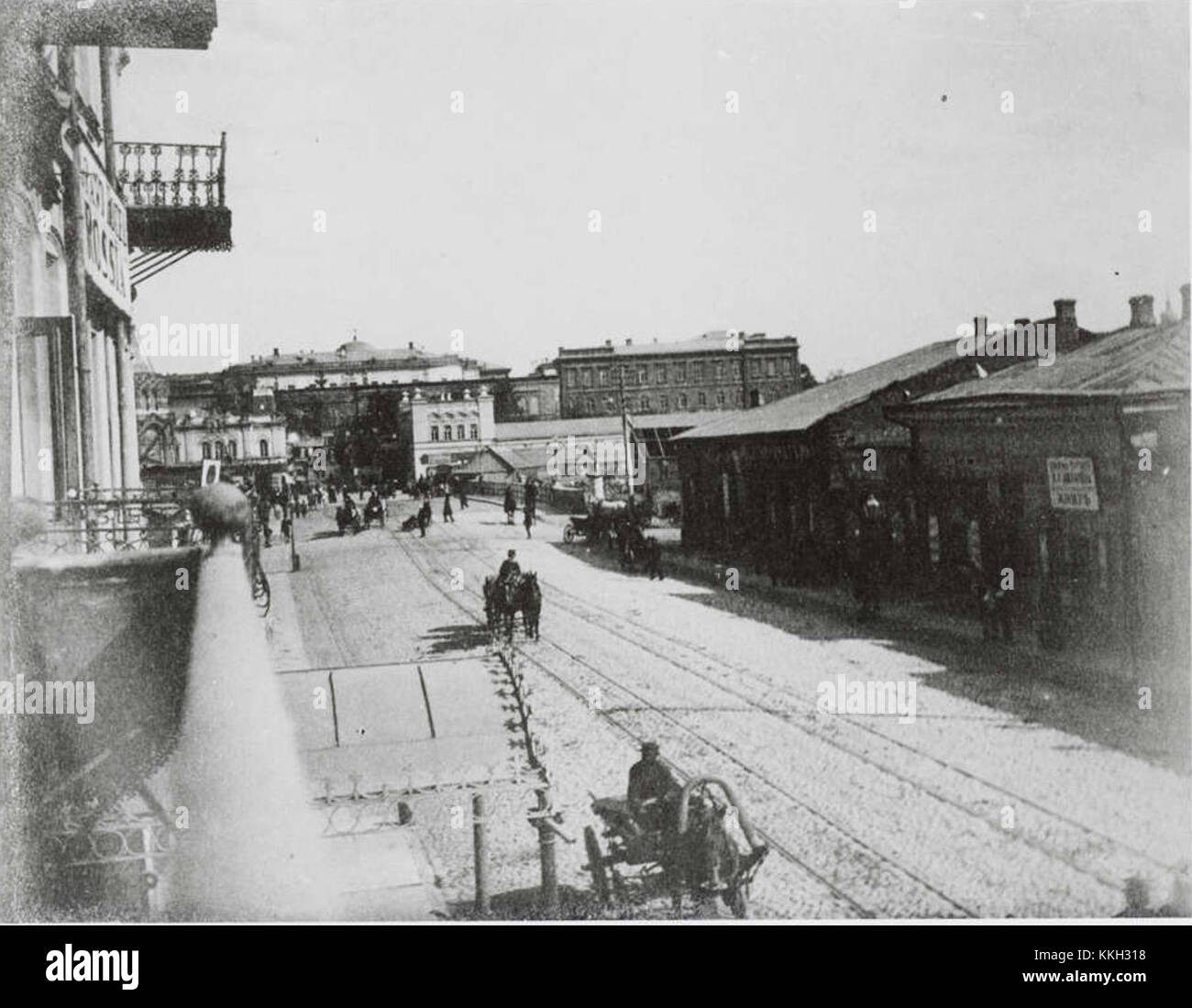This image depicts a street scene from the 1890s, showing the typical ...