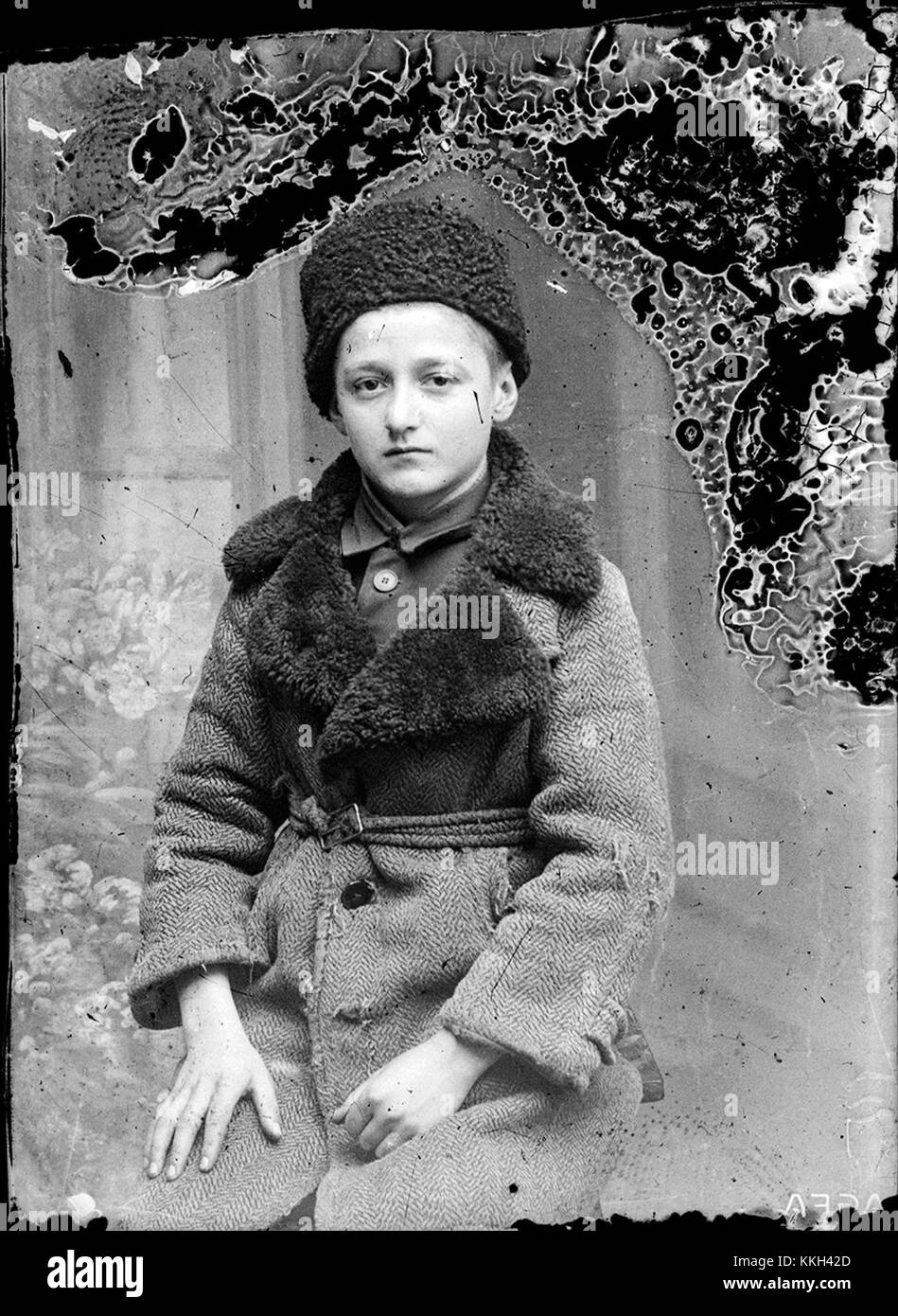 A Romanian man is seen wearing a traditional hat in this image ...