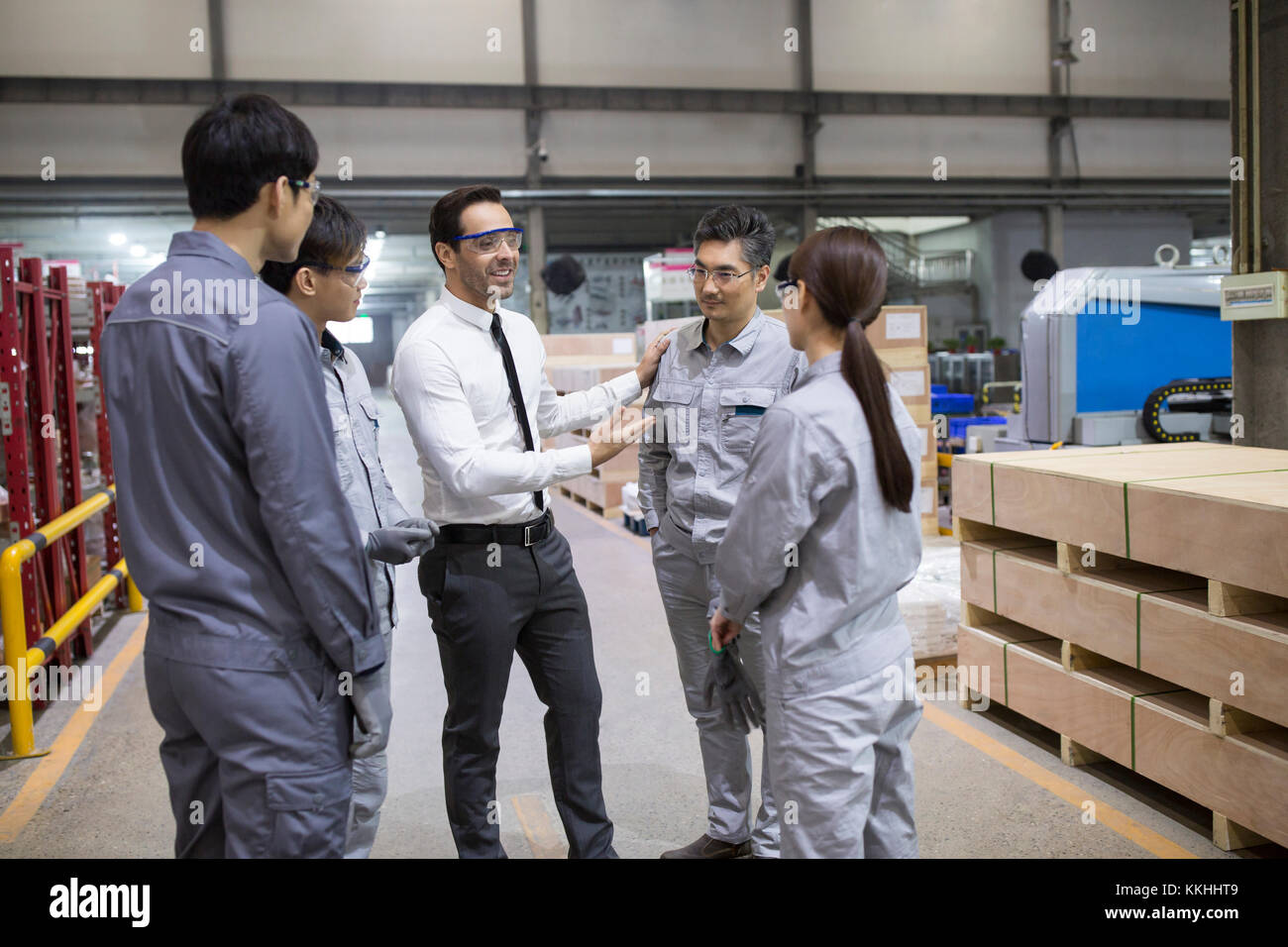 Businessman and engineers talking in the factory Stock Photo - Alamy