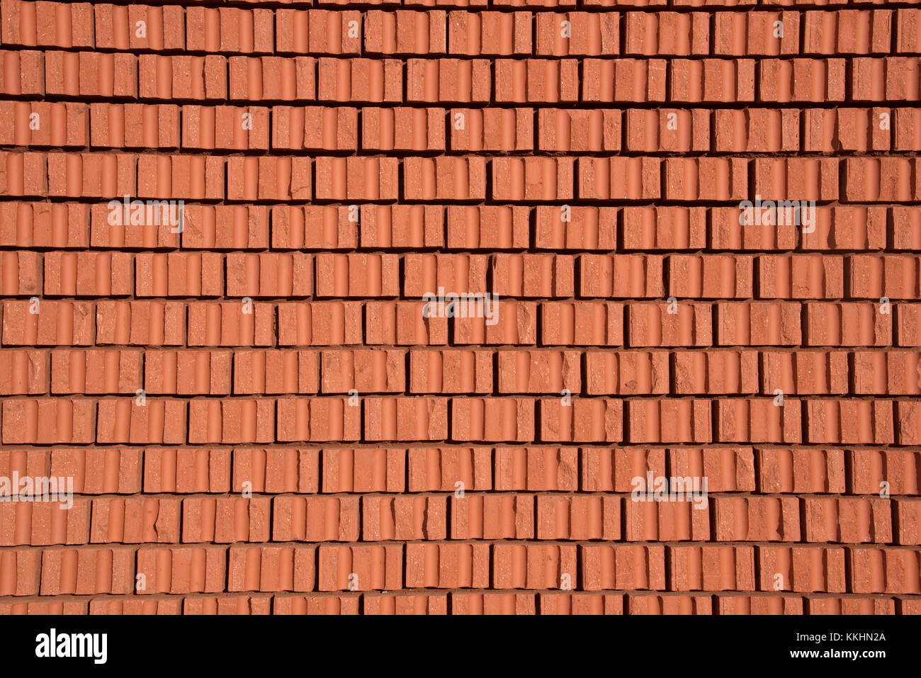 Brick wall texture of red stone blocks closeup as a background Stock ...