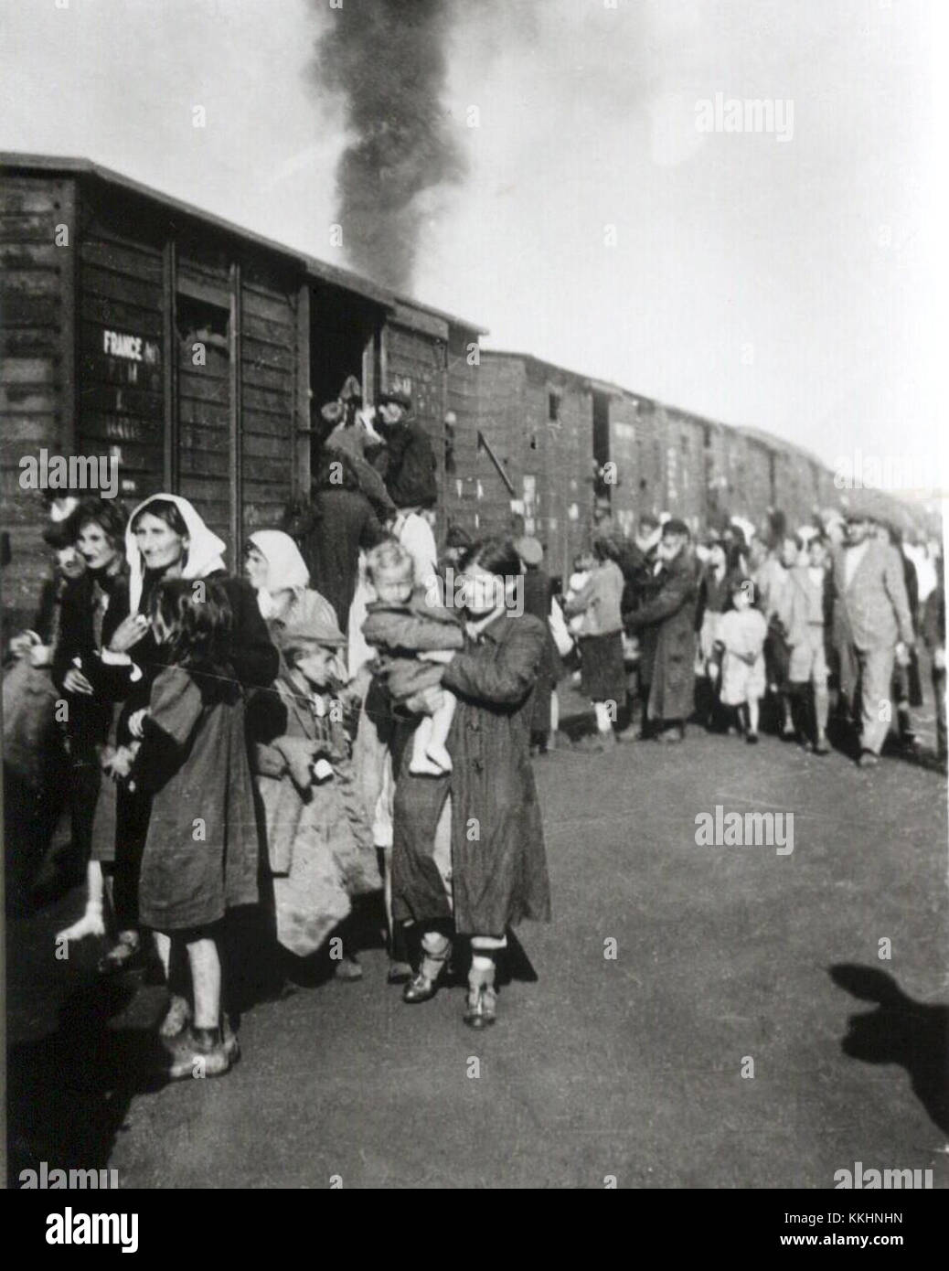This historical photograph shows the deportation of Jewish individuals ...
