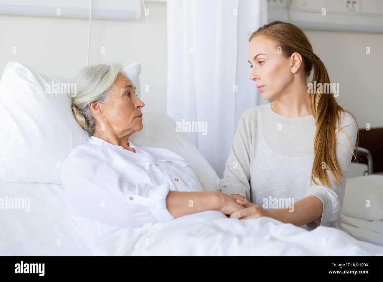 daughter visiting her senior mother at hospital Stock Photo - Alamy