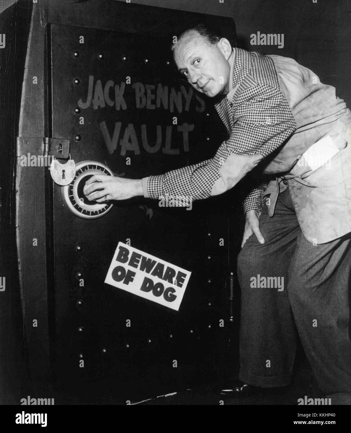 Jack Benny, a beloved American comedian, is pictured with a vault ...