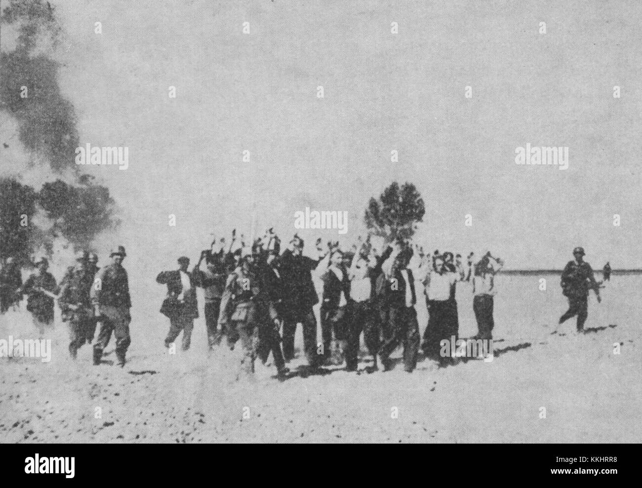 A 1939 photograph shows Polish men led to execution during the early ...