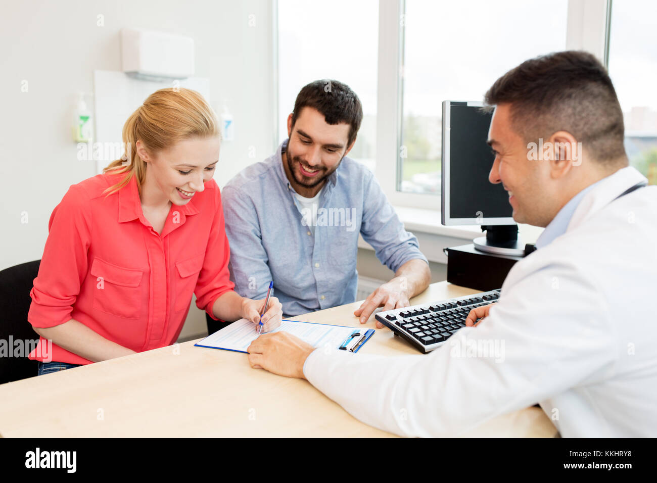 couple visiting doctor at family planning clinic Stock Photo - Alamy