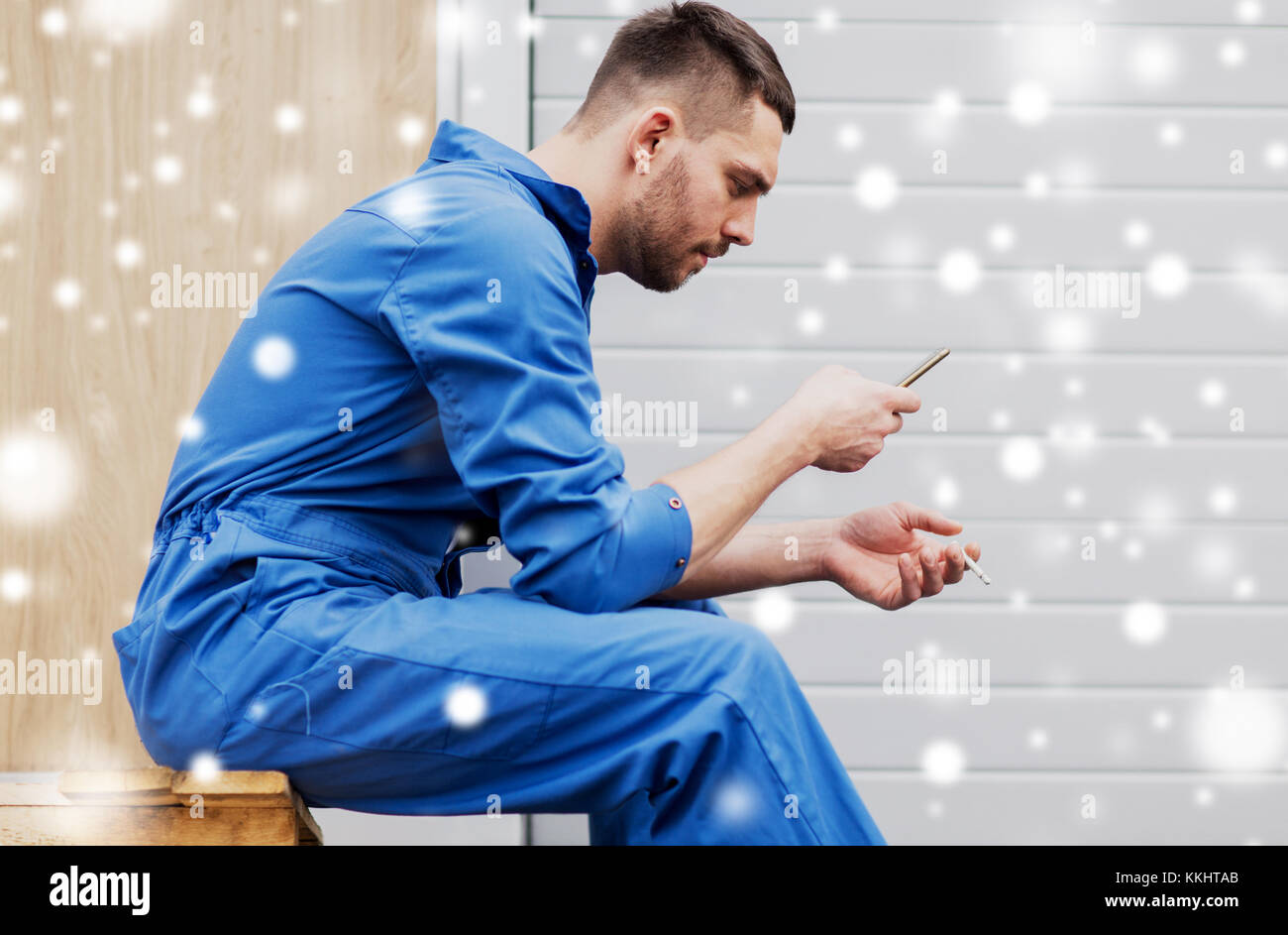 auto mechanic smoking cigarette at car workshop Stock Photo - Alamy