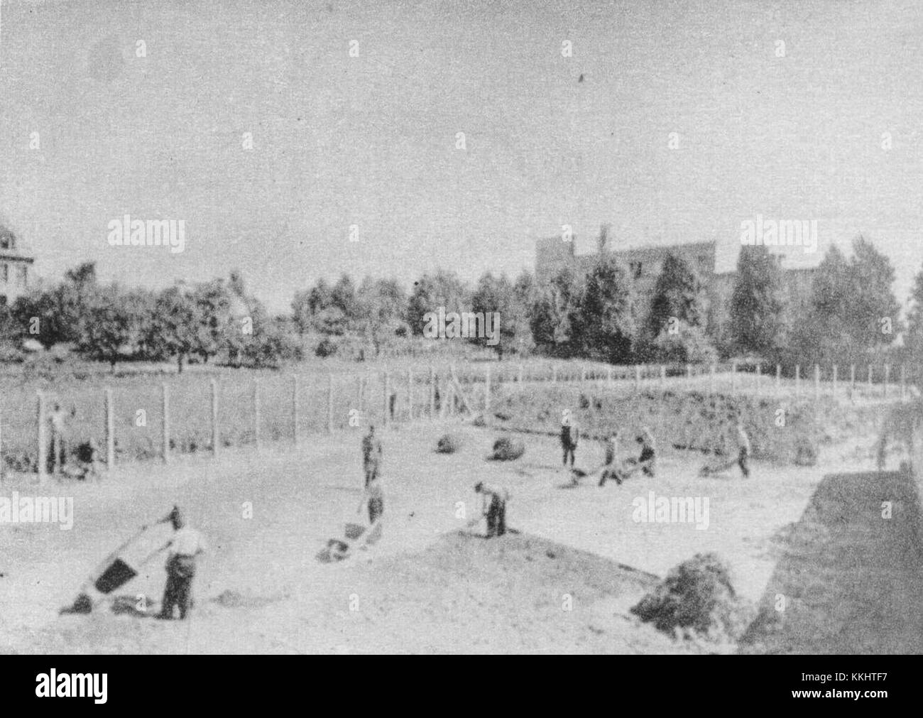 This historical image illustrates the forced labor of Polish prisoners ...