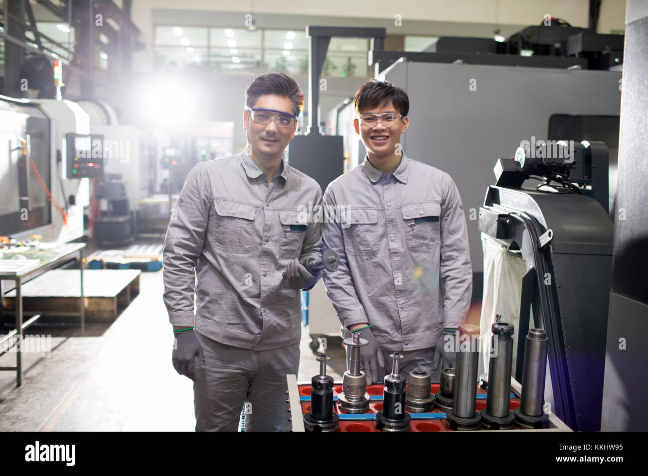 Confident Chinese engineers in the factory Stock Photo - Alamy
