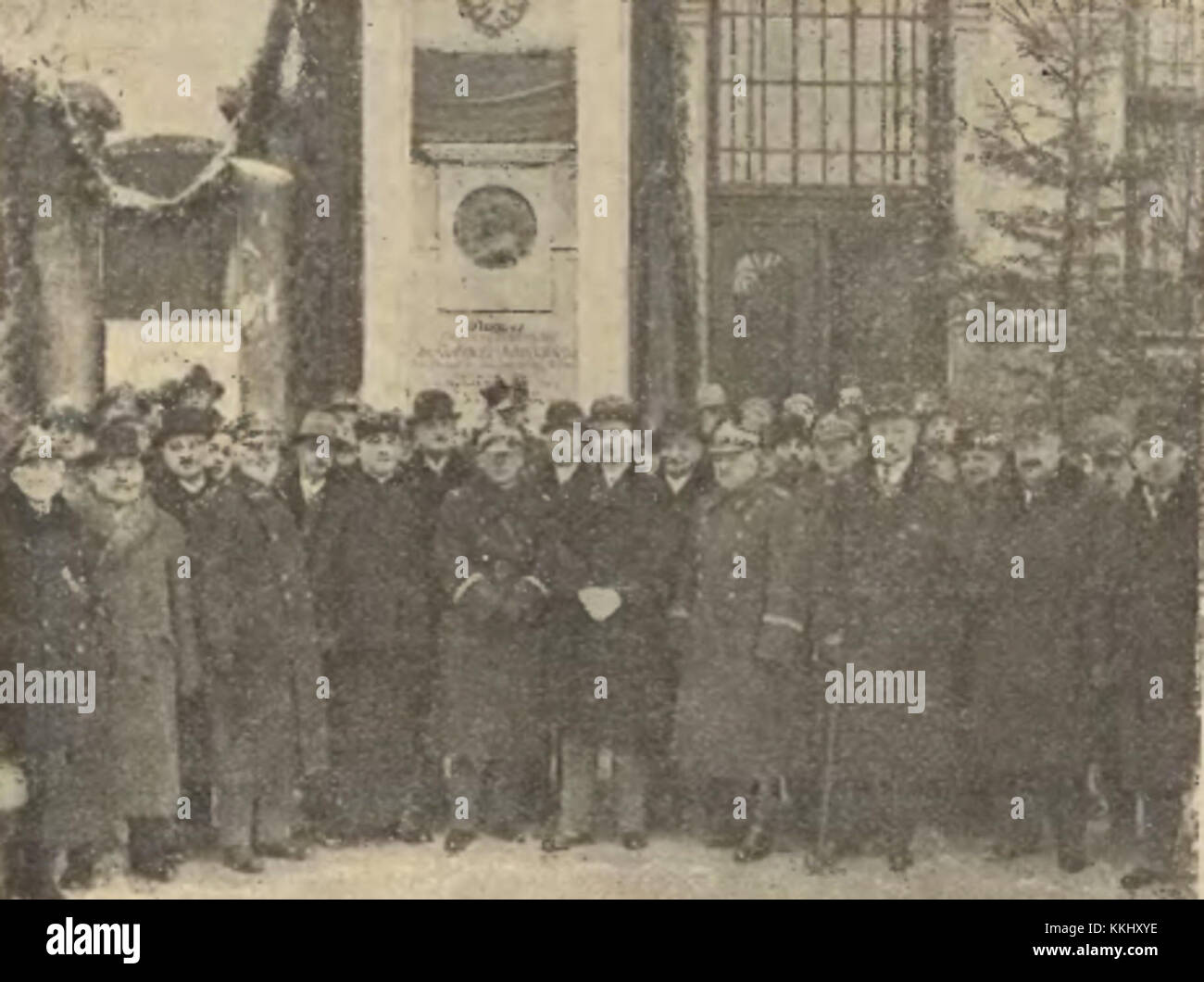 This image shows the unveiling of a commemorative plaque honoring ...