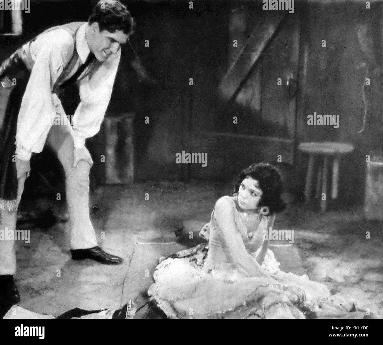 A still from the film *Border Romance*, depicting a scene set in a tumultuous border region. The ...