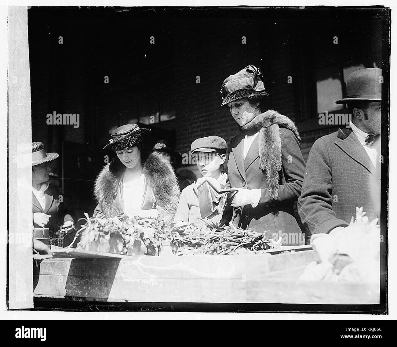 The image features Mrs. Houston and Mrs. Grayson in a market setting ...
