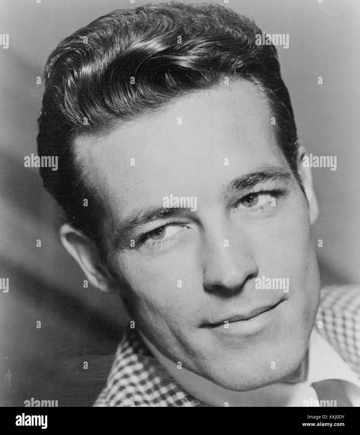 Guy Madison, an American actor, is shown in a portrait from 1957. He is ...