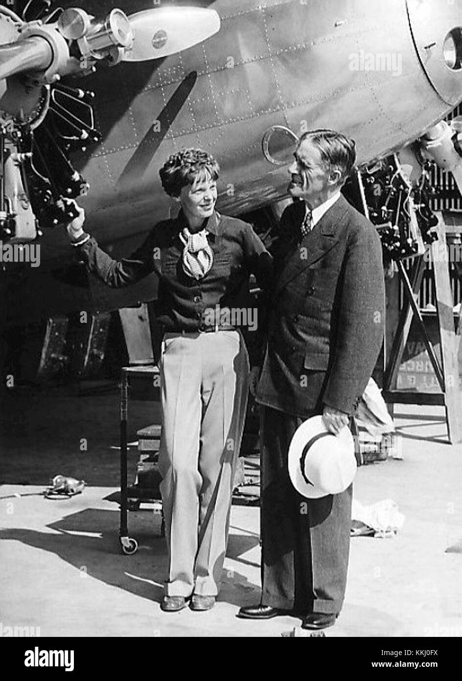 Amelia Earhart poses with her Lockheed Electra aircraft in 1936, a ...