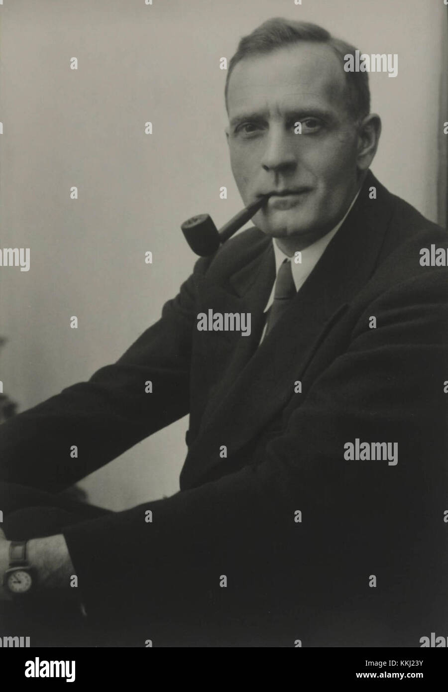 This studio portrait photograph captures Edwin Powell Hubble, the ...