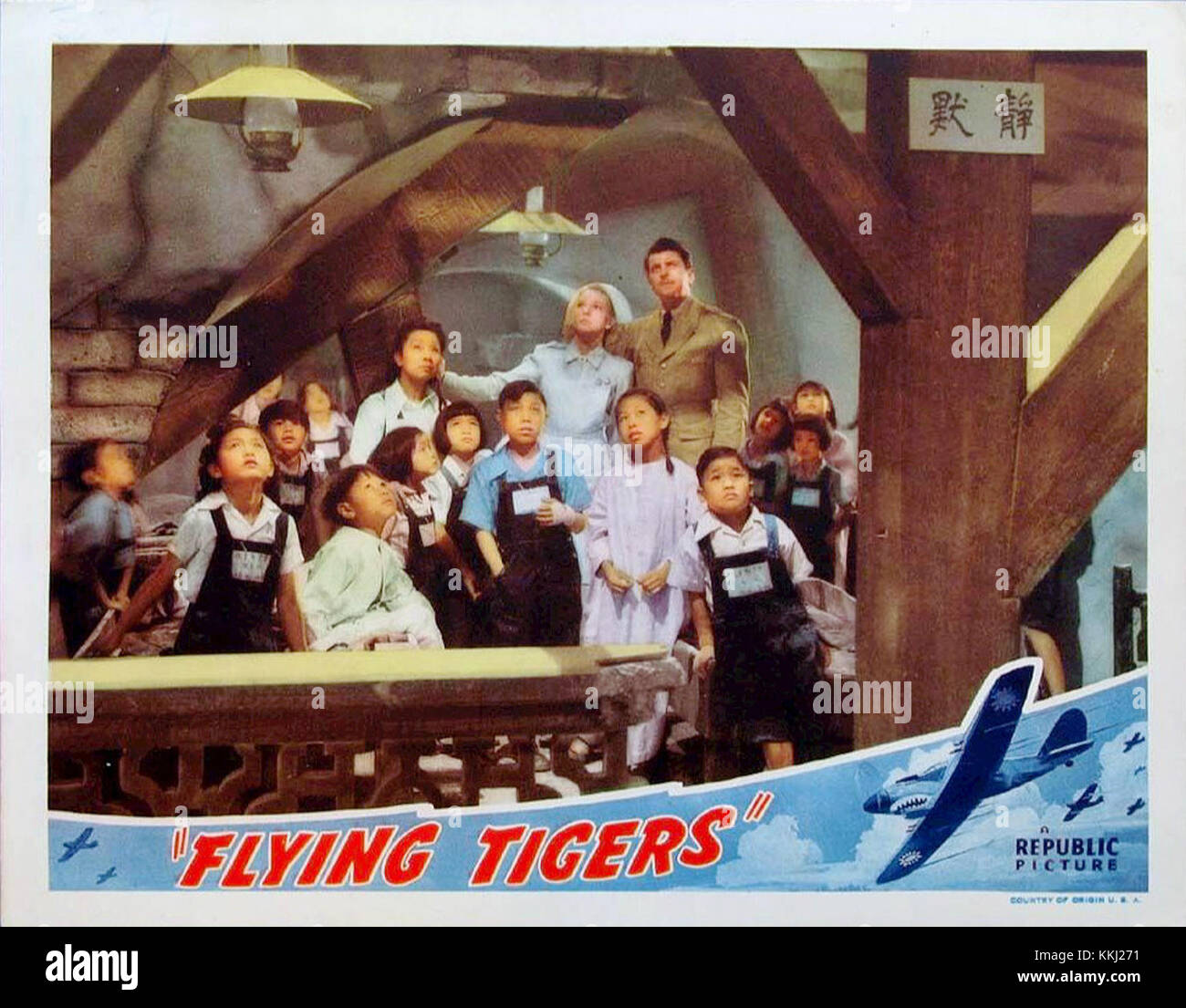 A lobby card from the movie 'Flying Tigers,' featuring the iconic film ...