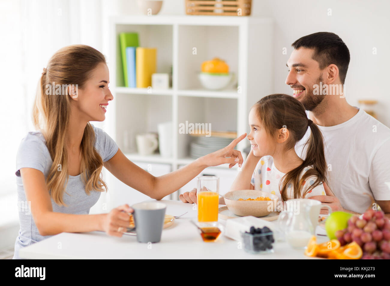 happy family having breakfast at home Stock Photo - Alamy