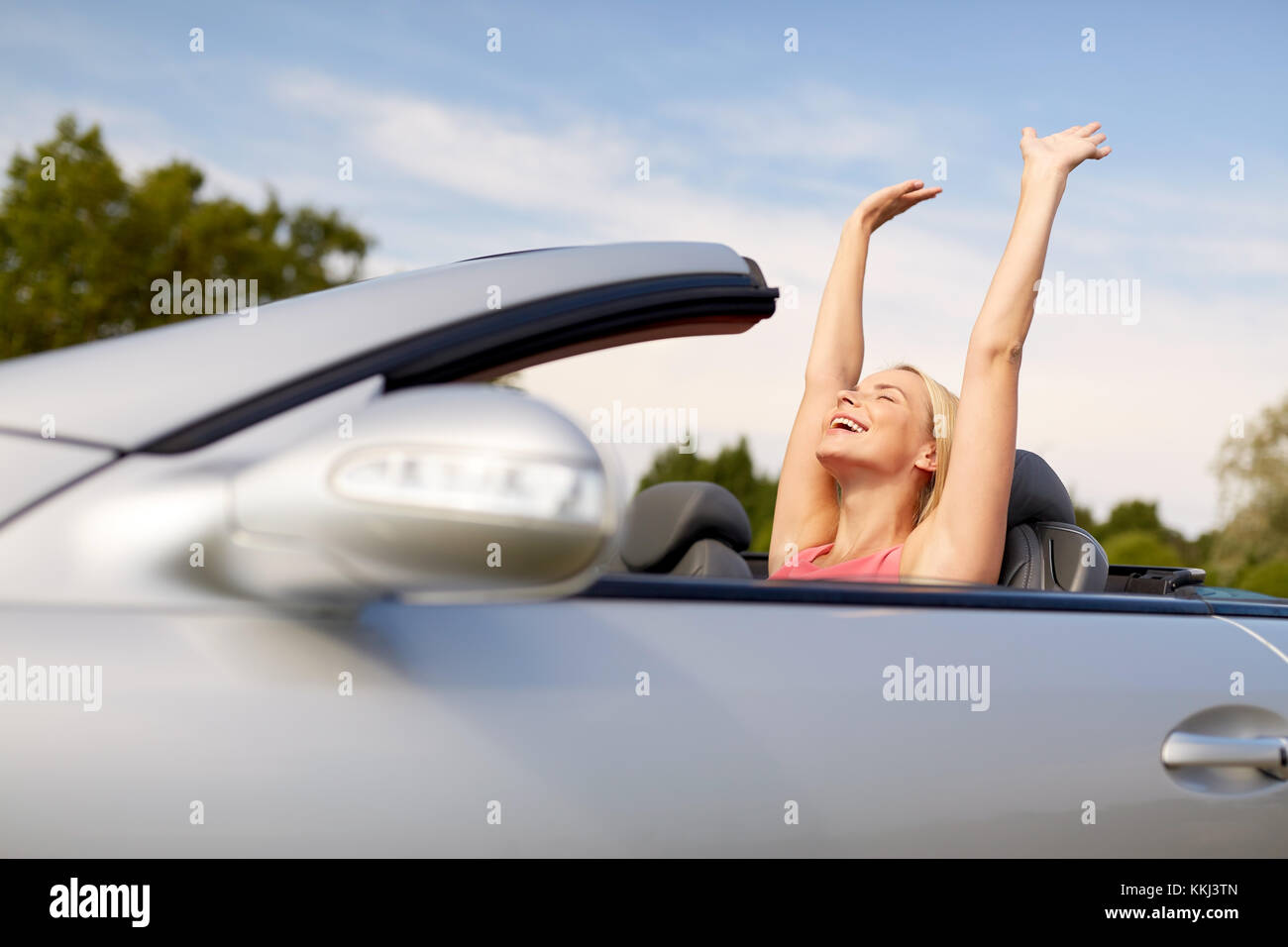 happy young woman in convertible car Stock Photo - Alamy