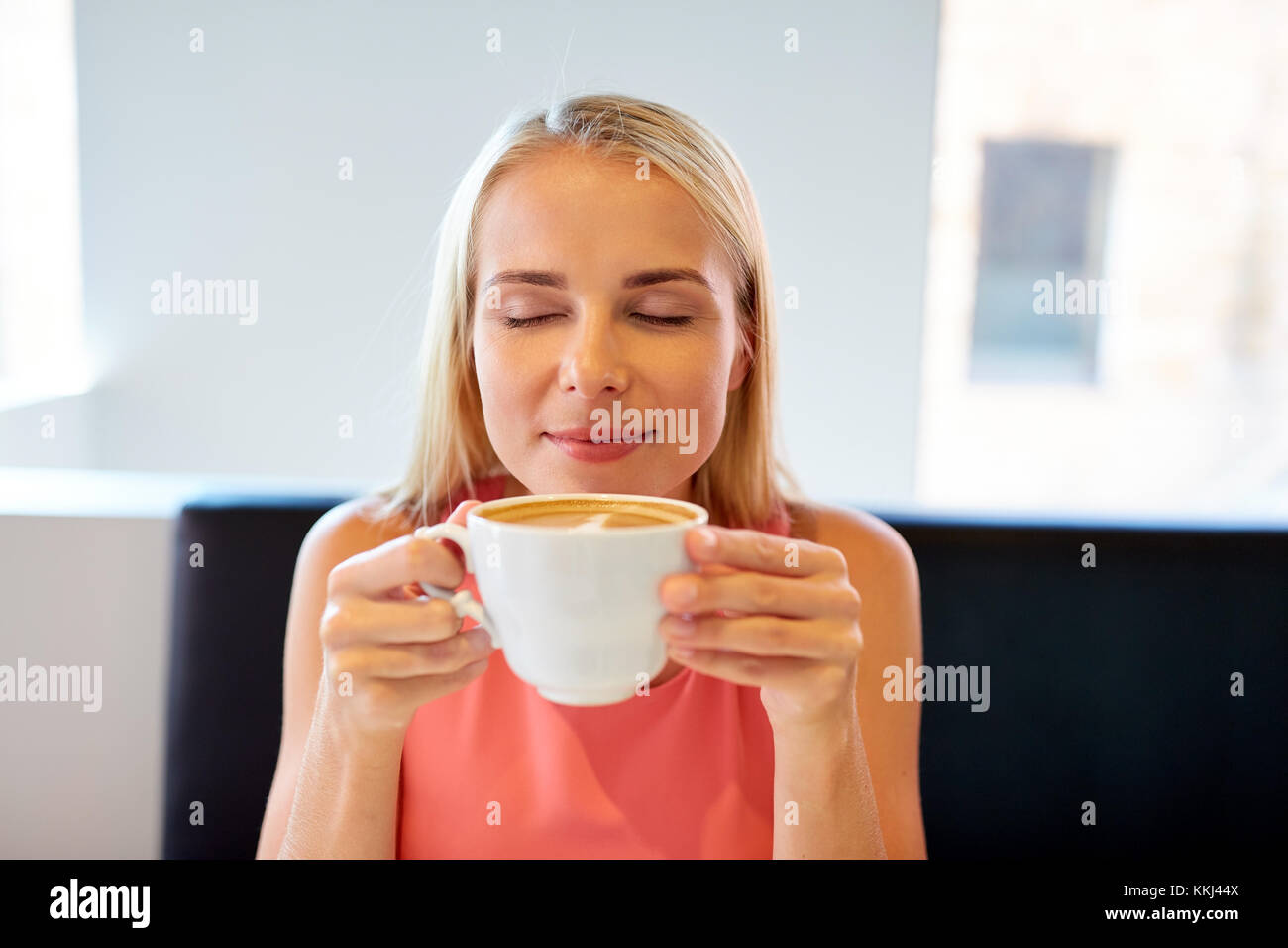 close up of woman drinking coffee at restaurant Stock Photo - Alamy